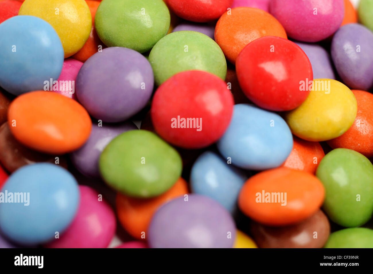 Multi coloured sugar coated chocolate Stock Photo - Alamy