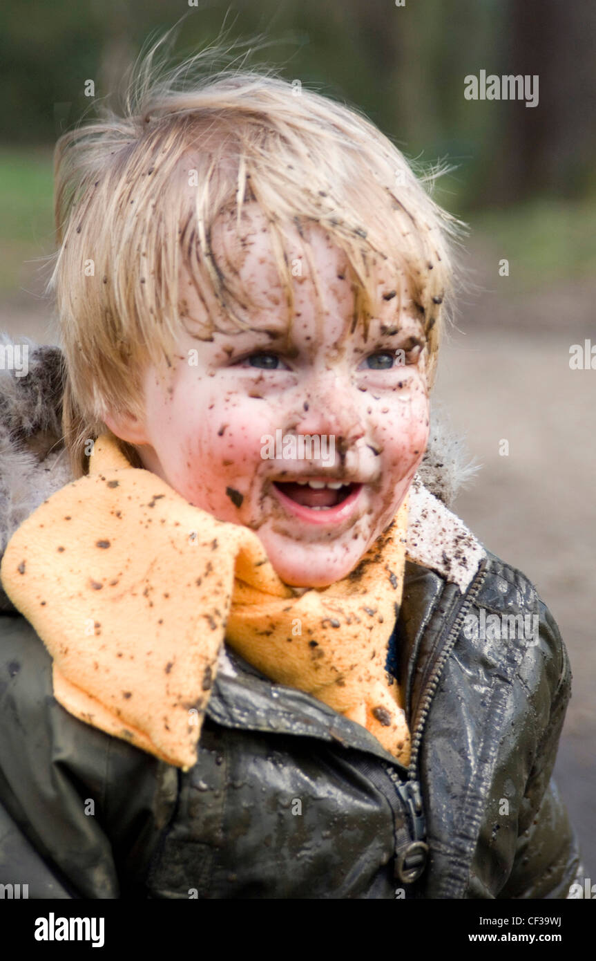 A male child with mud splattered over his face Stock Photo - Alamy
