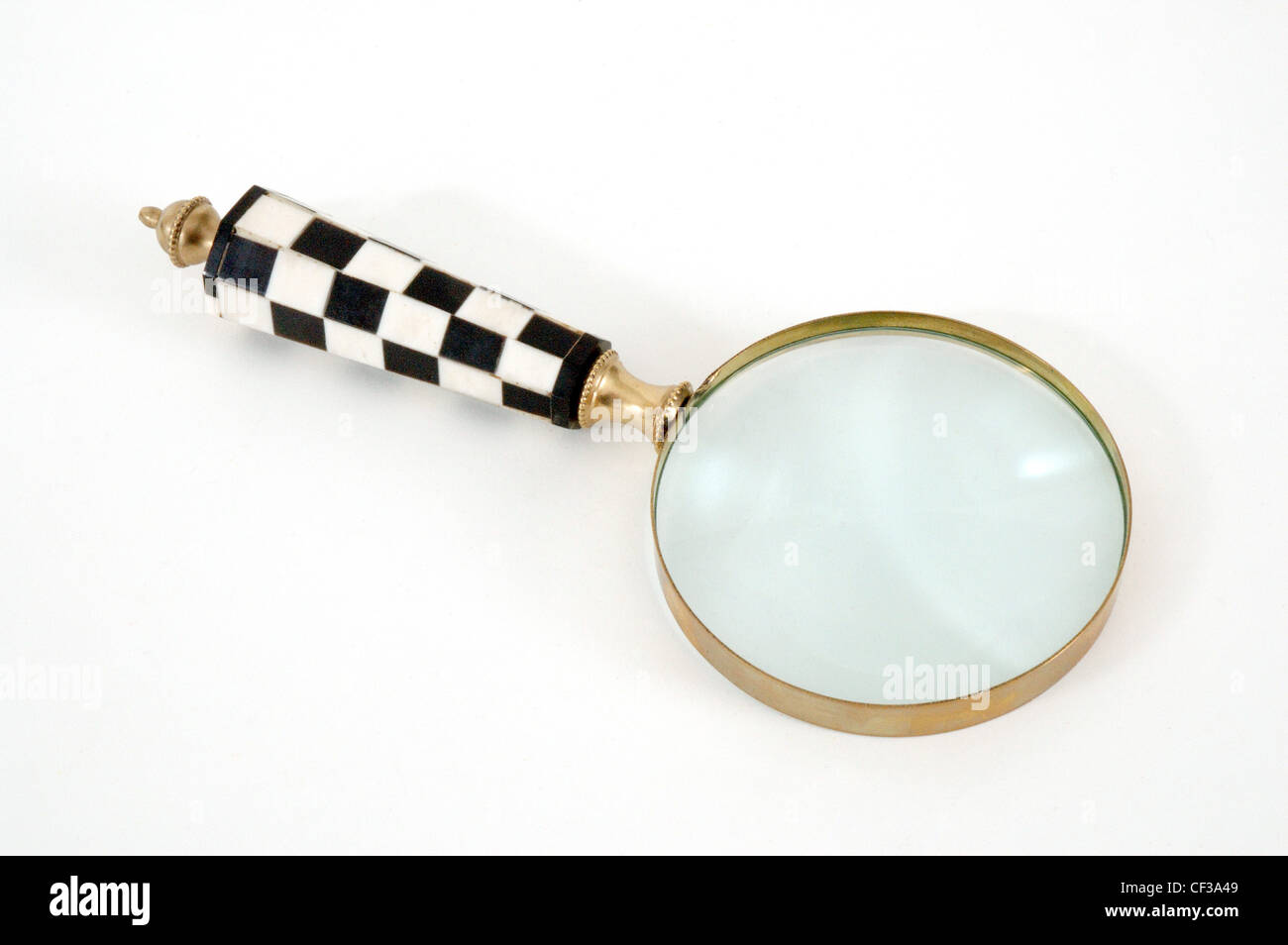 A magnifying glass with a black and white checkered handle Stock Photo ...