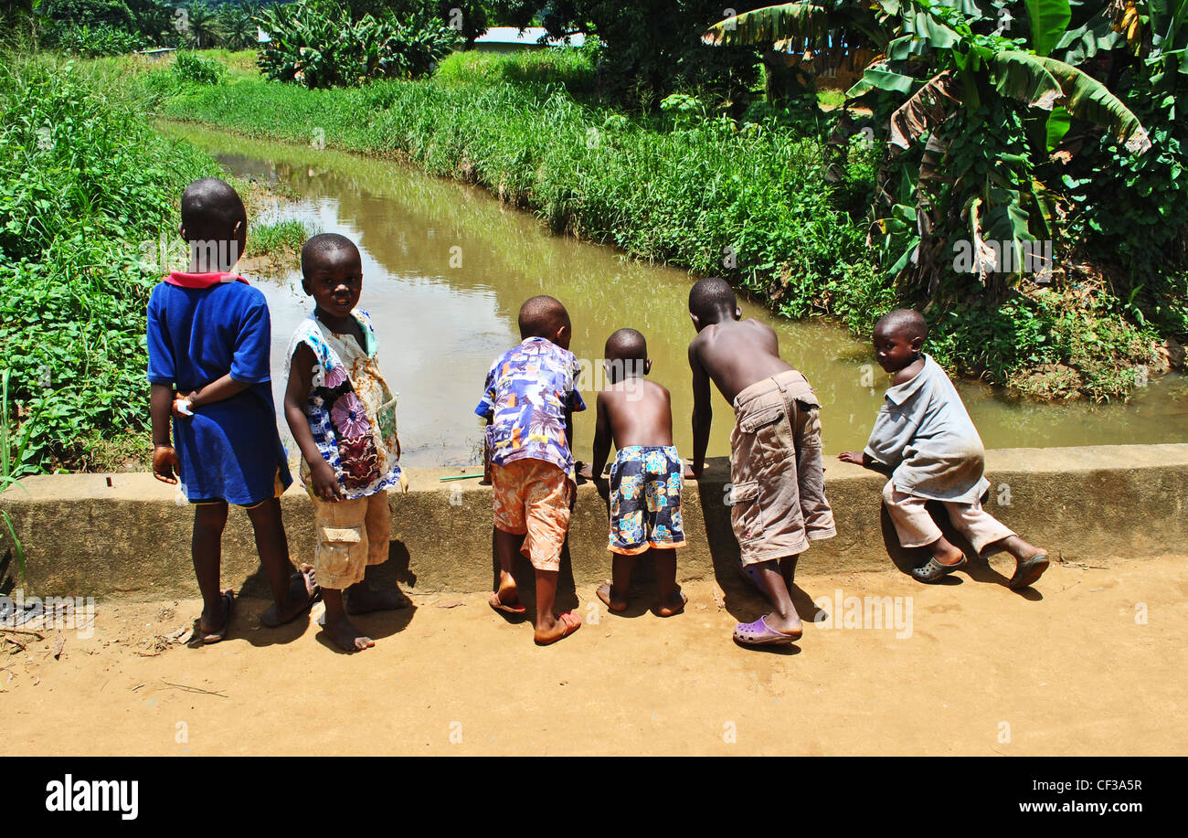 Boys look over a bridge in Kenema, Sierra Leone Stock Photo - Alamy