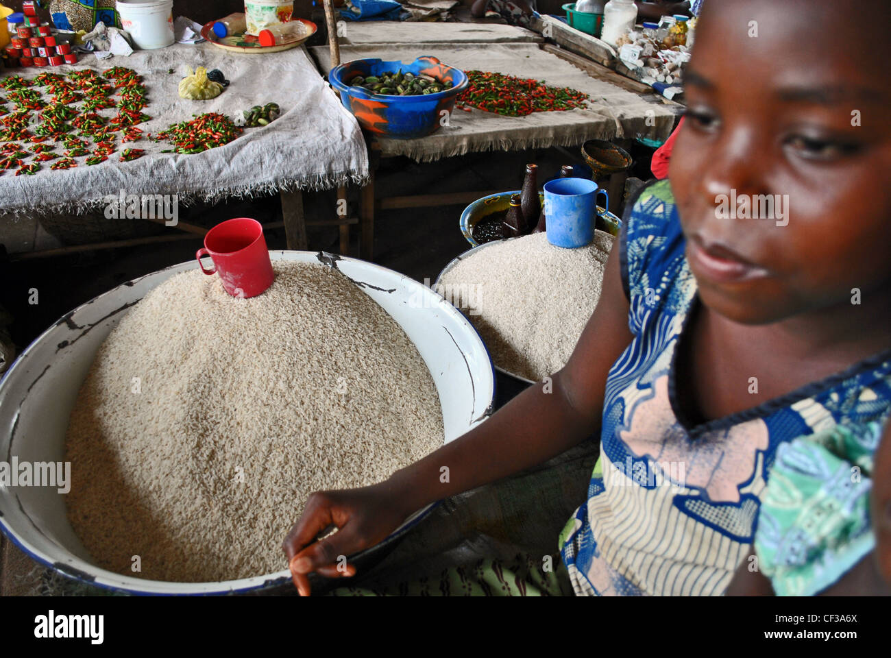 Girl selling rice in a market in Kenema, Sierra Leone Stock Photo - Alamy