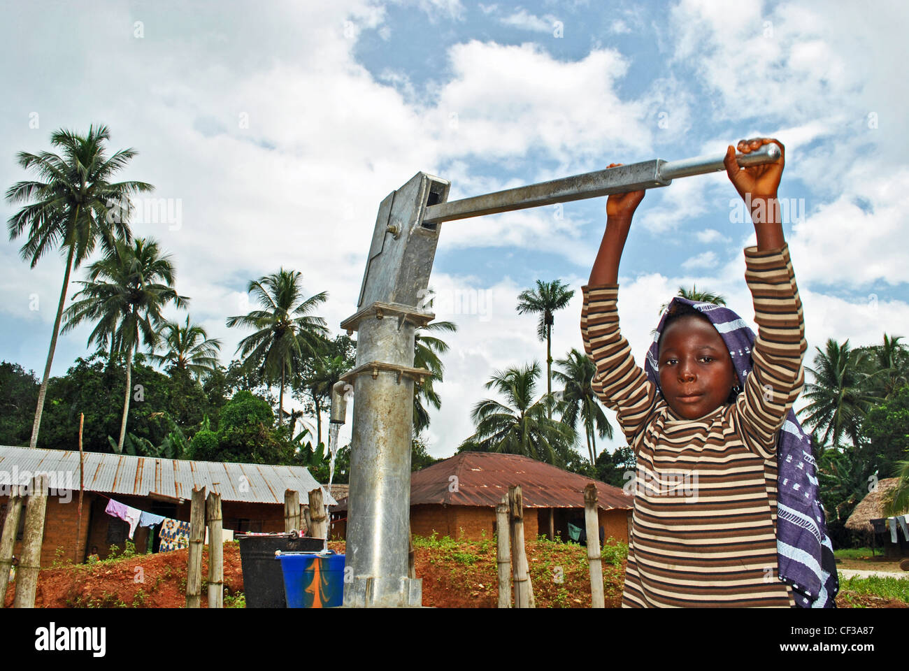 Children collecting water from well hi-res stock photography and images ...