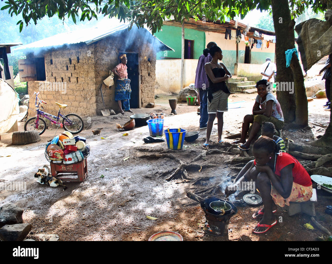 Busy village scene with cooking stove in Kabala, Sierra Leone Stock ...