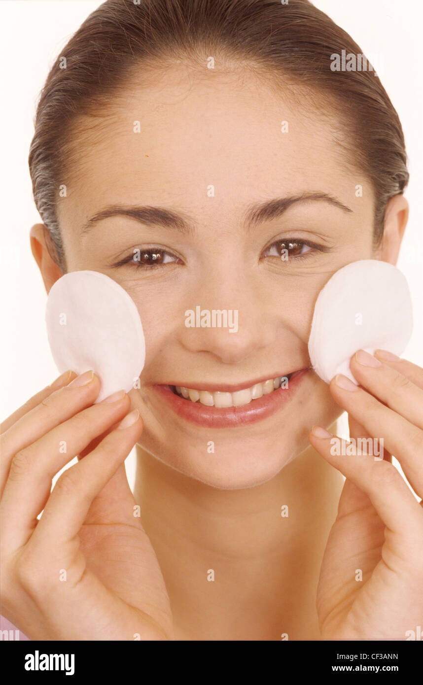 Beauty and Lifestyle: Young brunette female her hair pulled back white ...