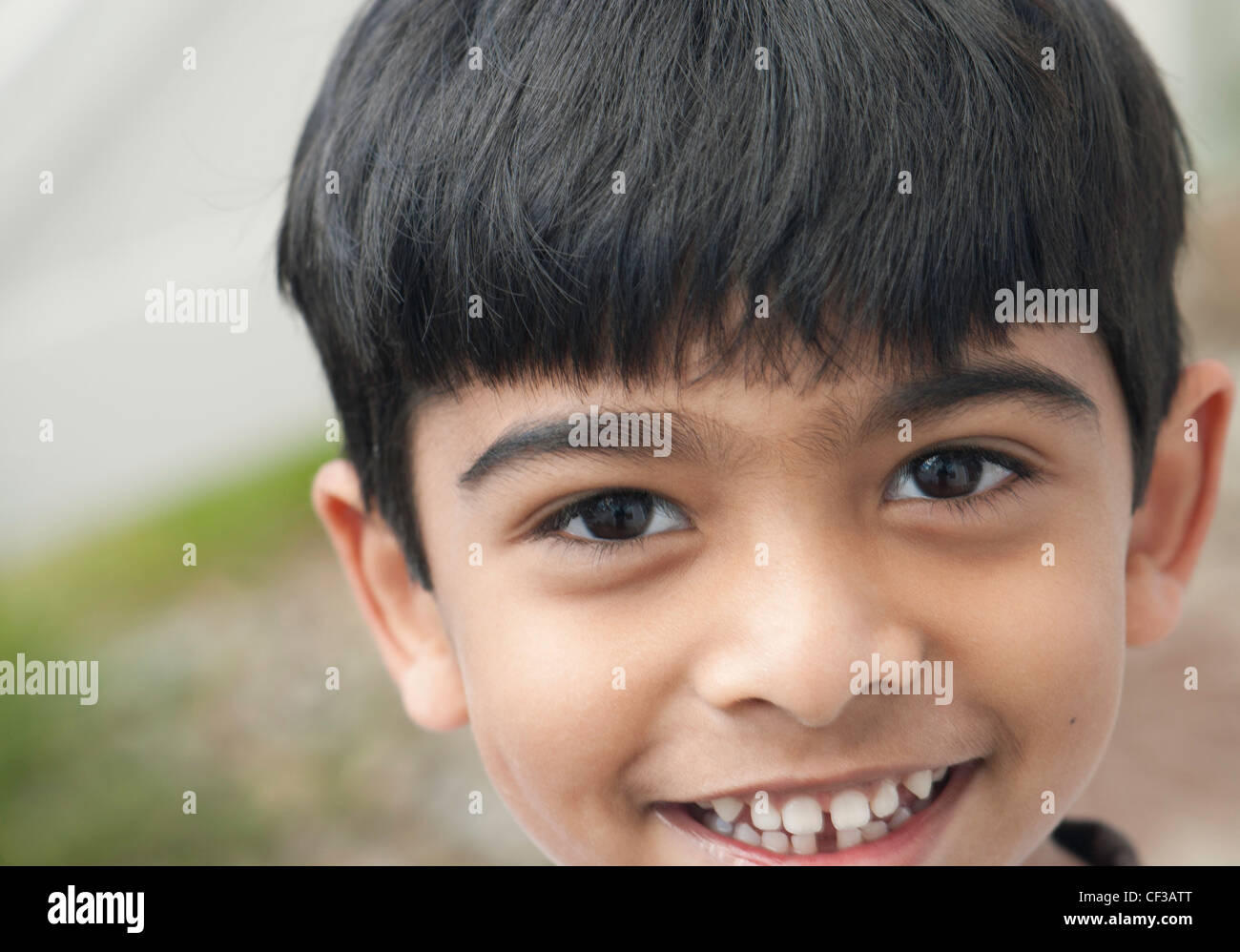 A boy smilling at camera in out door Stock Photo - Alamy