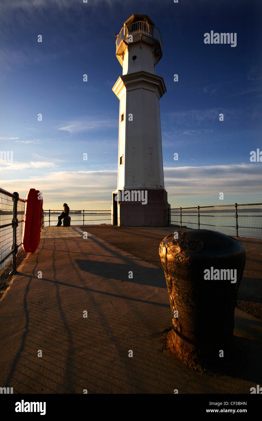 A view of the lighthouse at sunset at the Port of Leith in Edinburgh ...