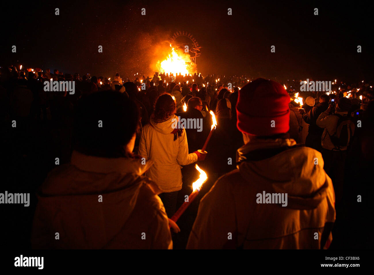 A crowd of people looking toward the Calton Hill Bonfire in Edinburgh ...