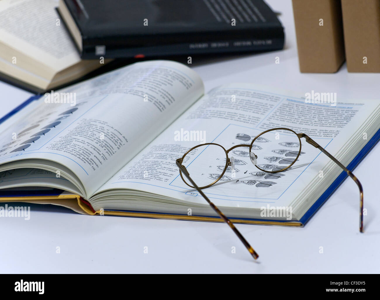Pair glasses book hi-res stock photography and images - Alamy