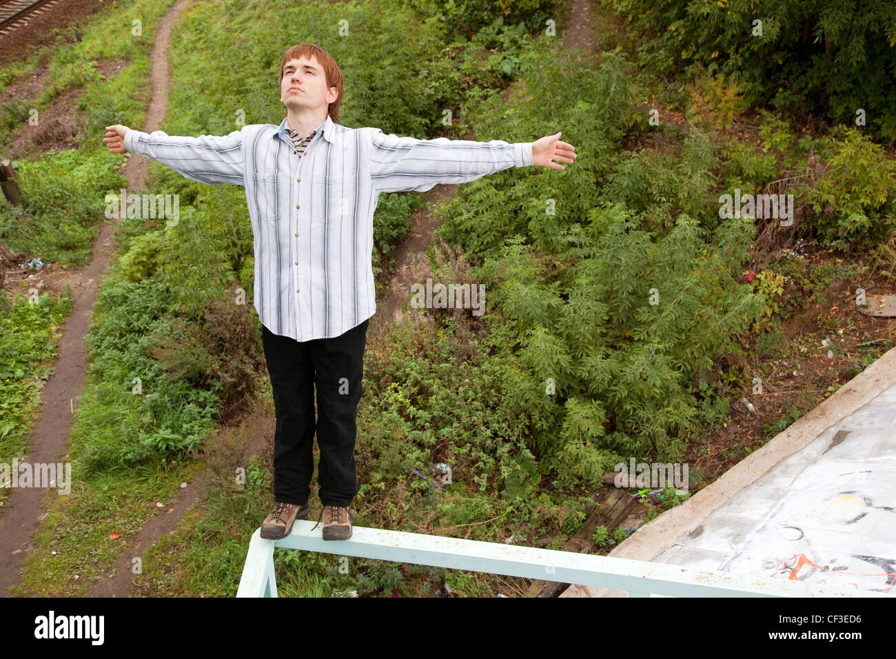 man guy is falling from the bridge Stock Photo - Alamy