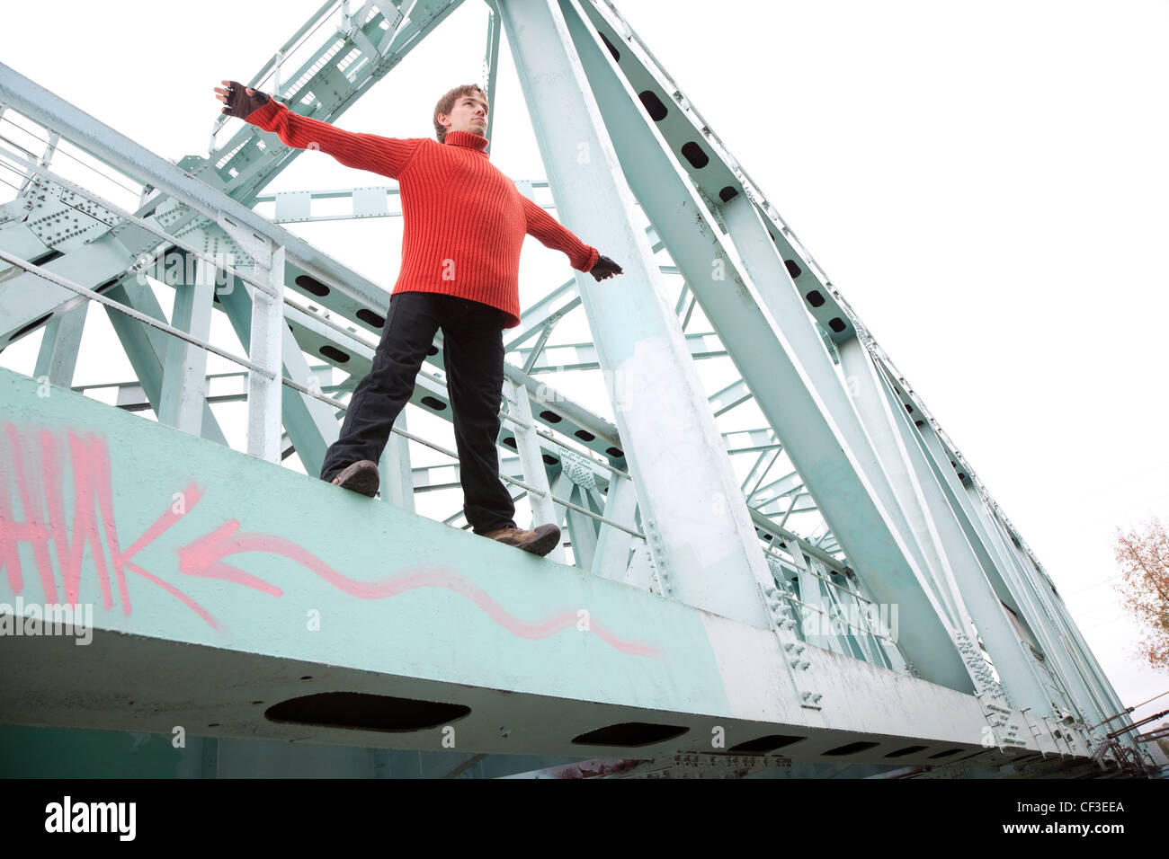 man guy is falling from the bridge stand Stock Photo - Alamy