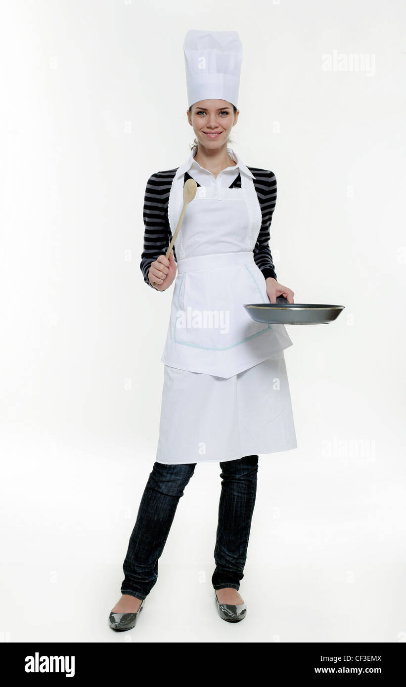 Female wearing white cooks hat, white apron, grey striped top over a ...