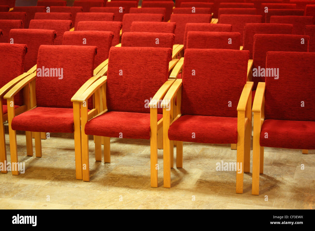 red wood chairs in auditorium Stock Photo - Alamy