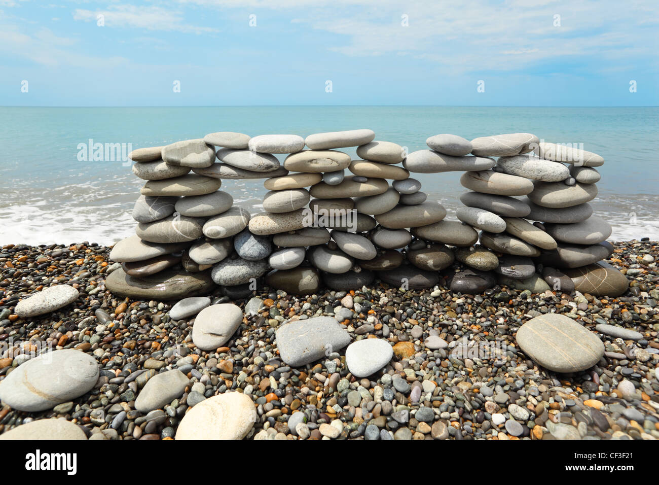 construction of many pebbles on a sea coast near water Stock Photo - Alamy