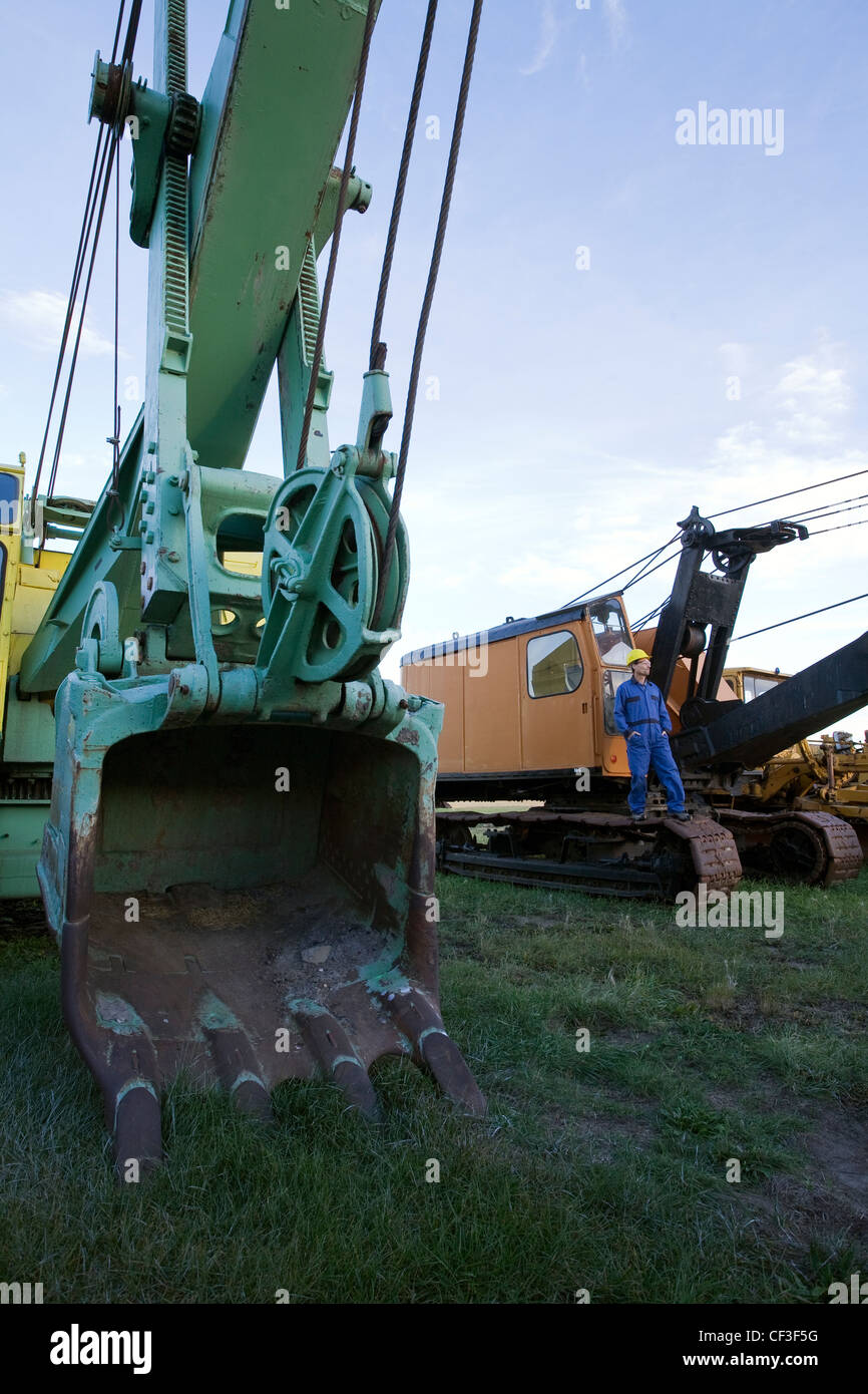 Heavy equipment operator standing next to excavating shovel Stock Photo ...