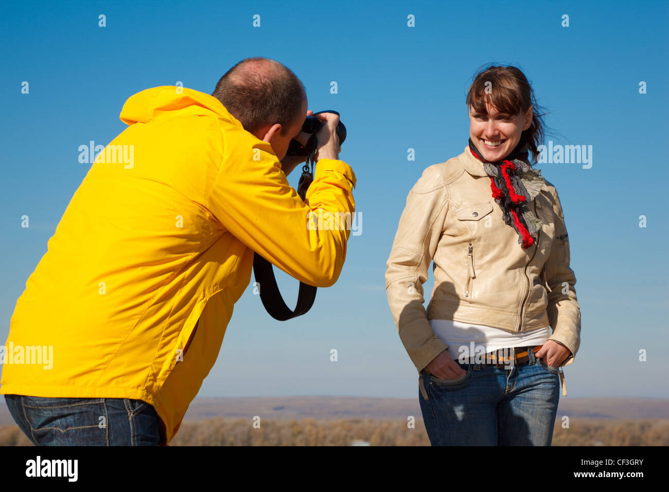 Girl poses for photographer, photosession on nature. Hobby which unites ...