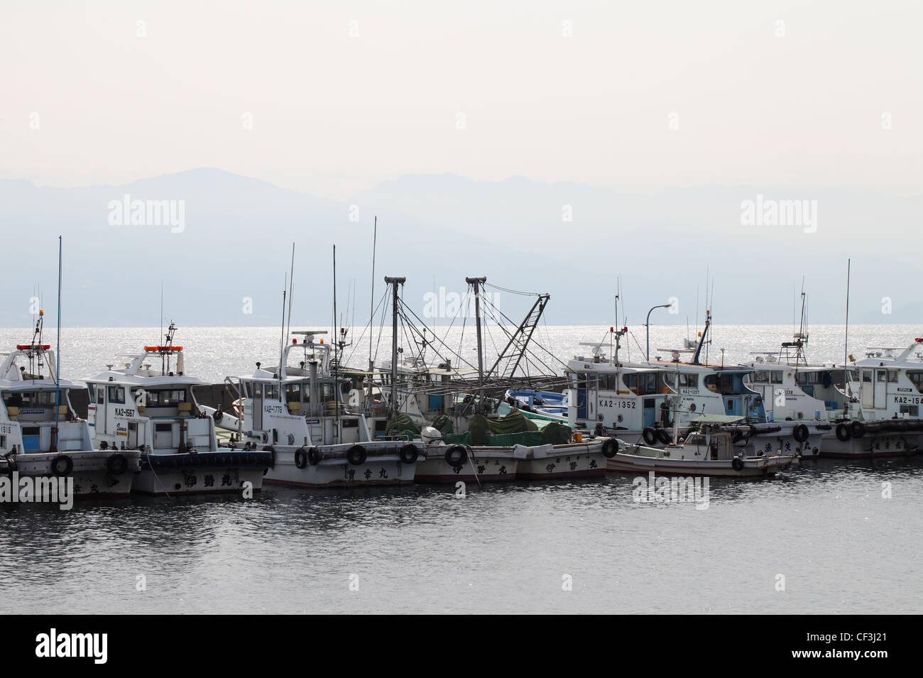 Fishing boats in a harbor Stock Photo - Alamy