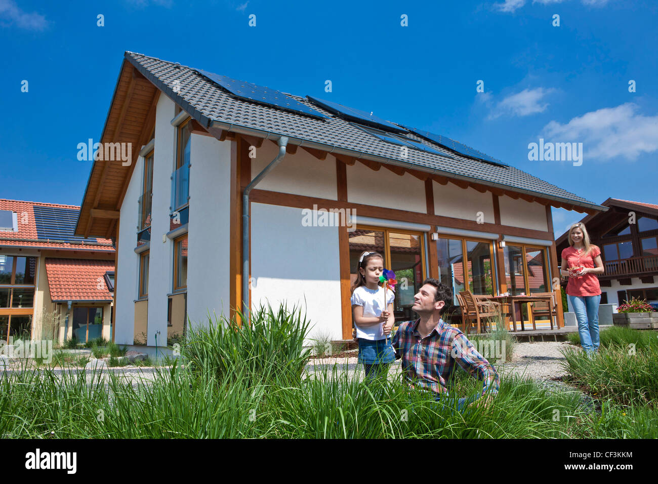 Family in front of Lehner energy house, Poing, Bavaria, Germany, Europe ...