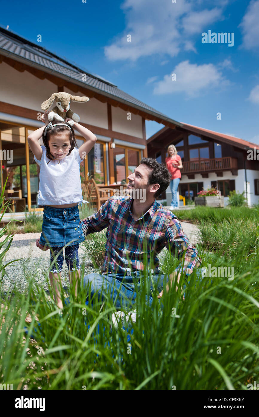 Family in front of Lehner energy house, Poing, Bavaria, Germany, Europe ...