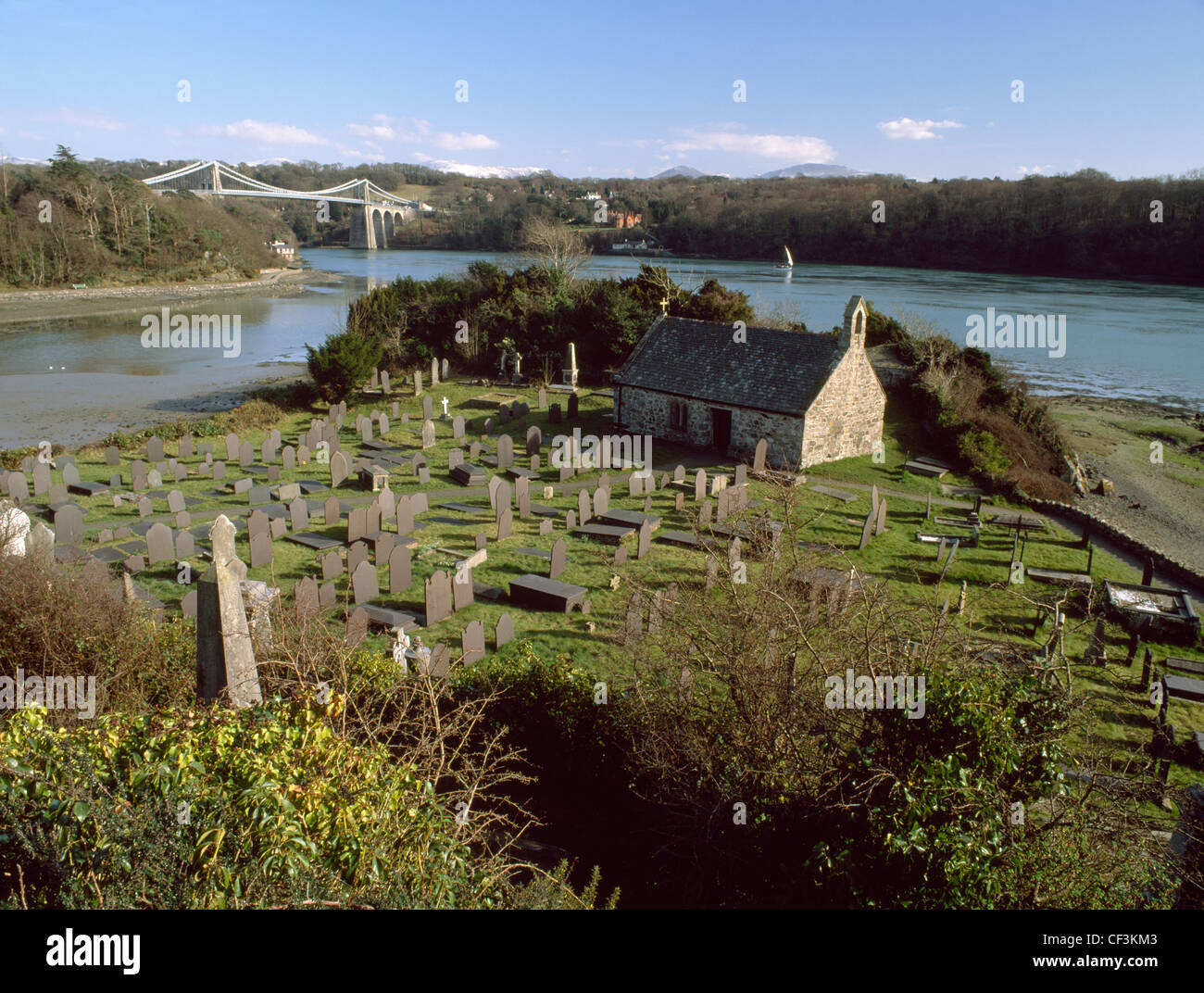 St Tysilio's church and graveyard on Church Island in the Menai Strait ...