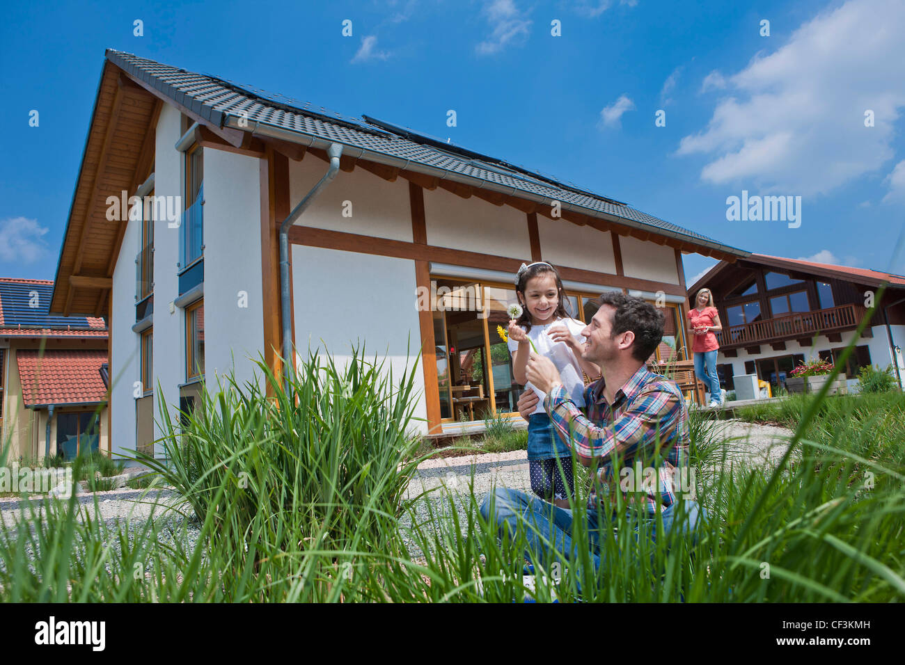 Family in front of Lehner energy house, Poing, Bavaria, Germany, Europe ...