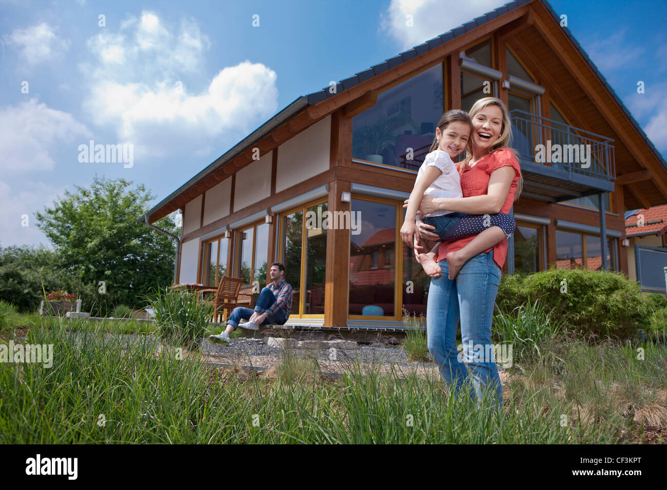 Family in front of Lehner energy house, Poing, Bavaria, Germany, Europe ...