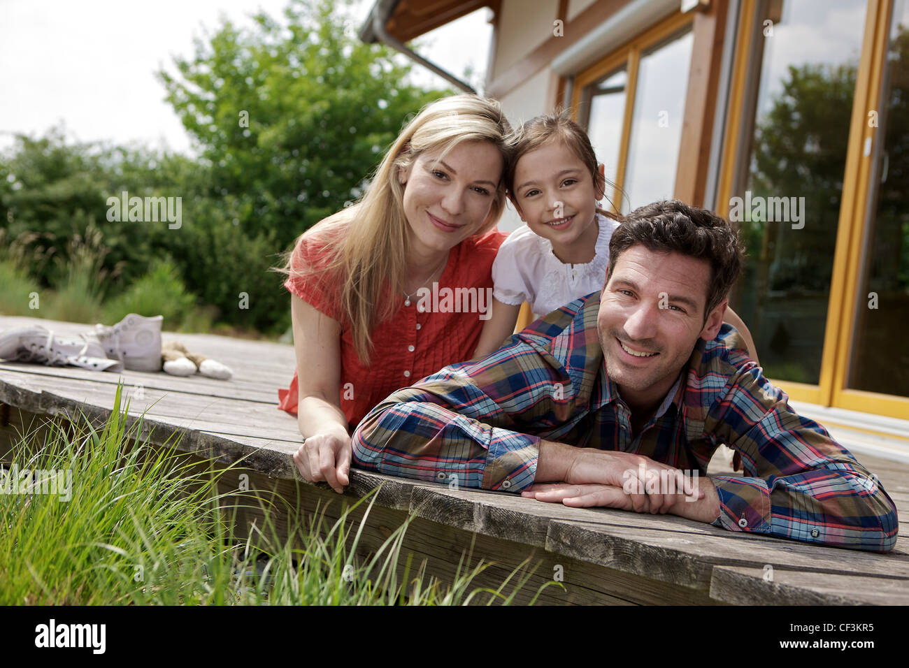 Family in front of Lehner energy house, Poing, Bavaria, Germany, Europe ...