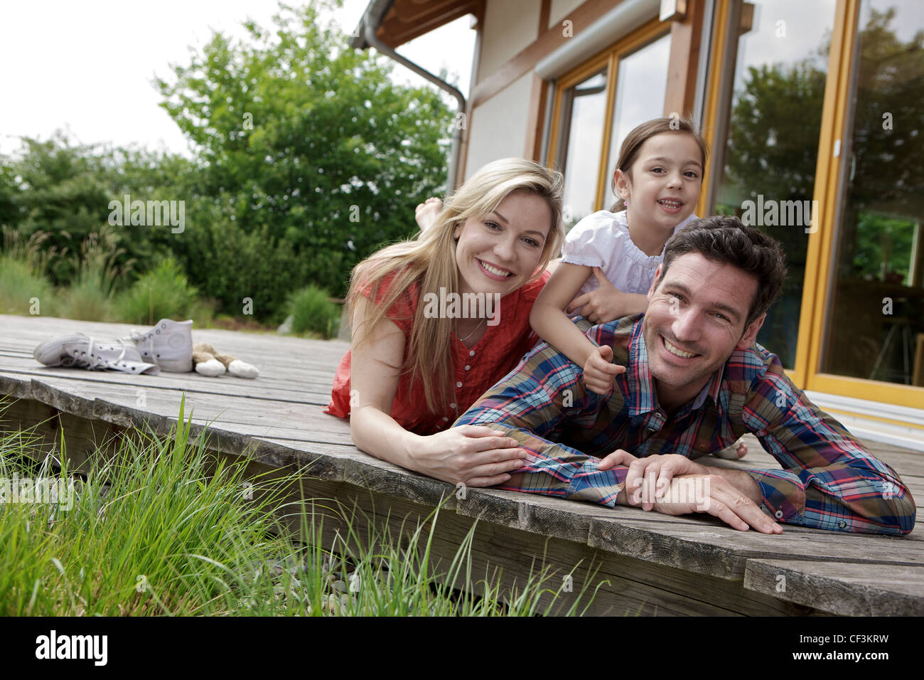 Family in front of Lehner energy house, Poing, Bavaria, Germany, Europe ...