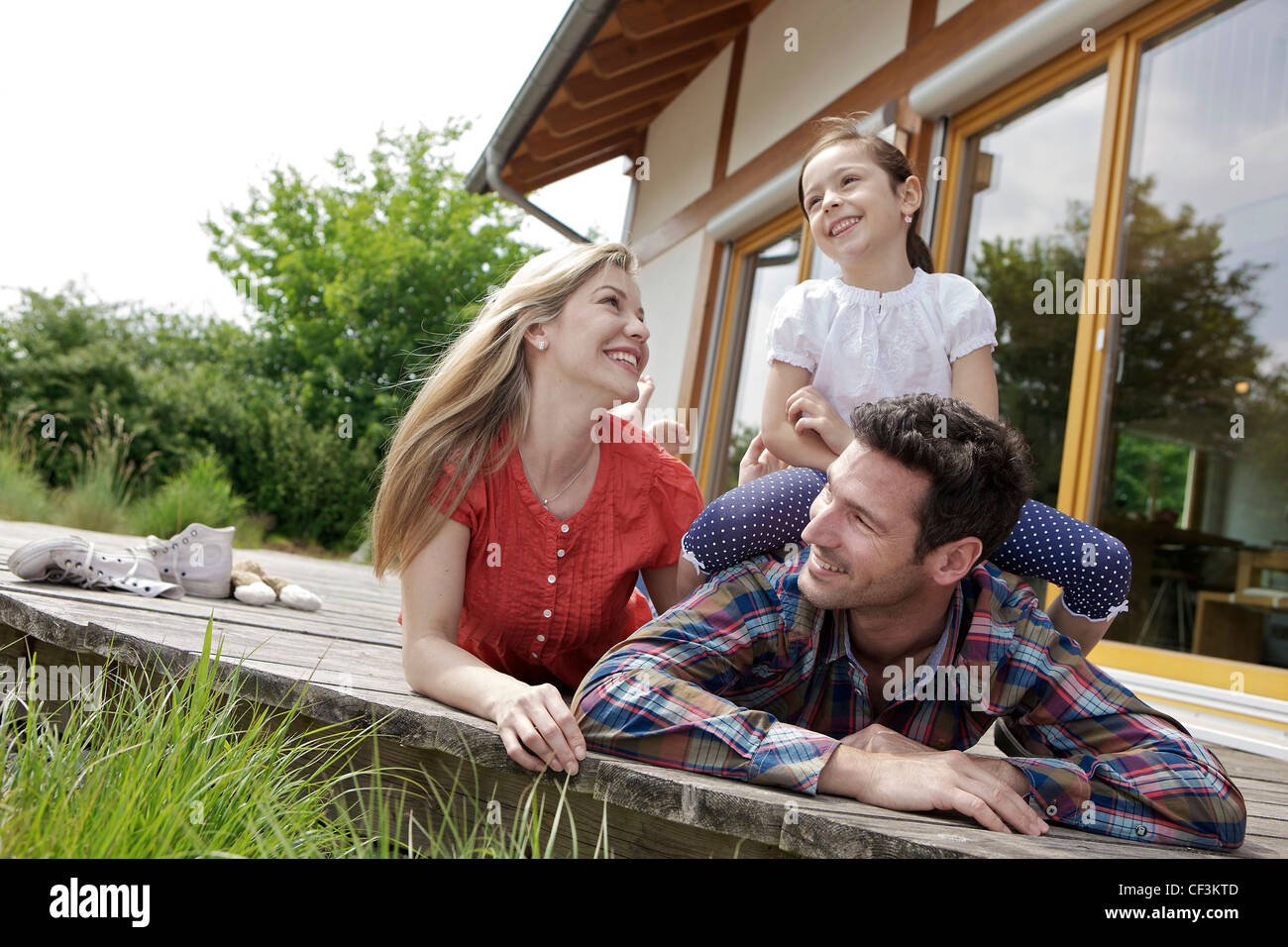 Family in front of Lehner energy house, Poing, Bavaria, Germany, Europe ...