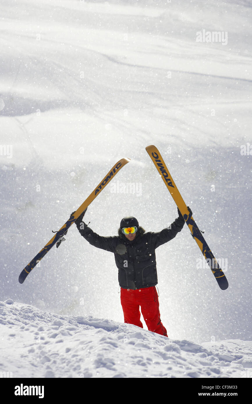 Skier standing at mountain Stock Photo - Alamy