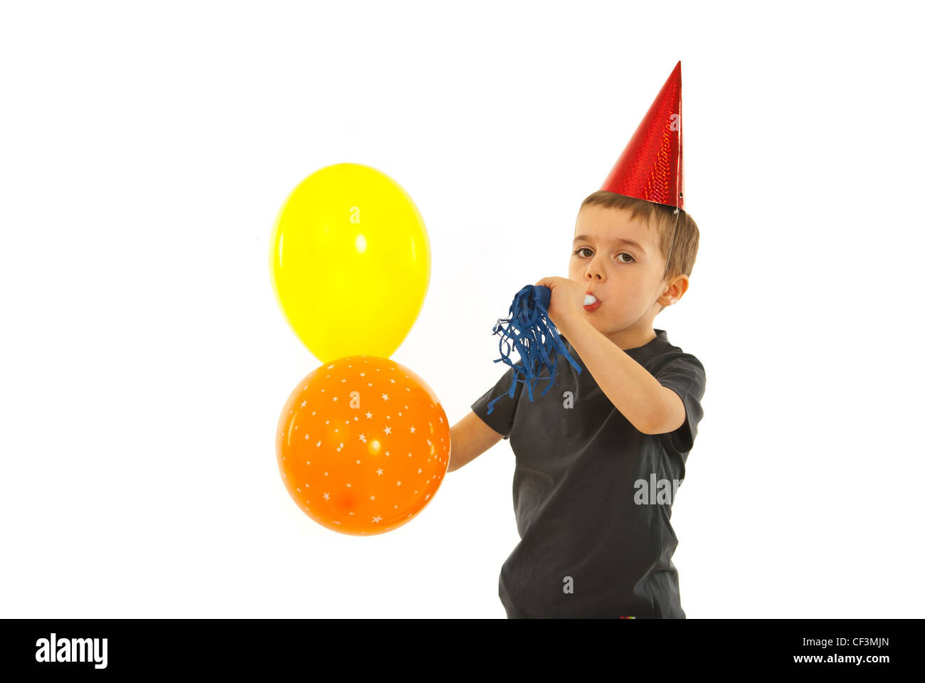 Party child boy with noise maker and balloons isolated on white ...