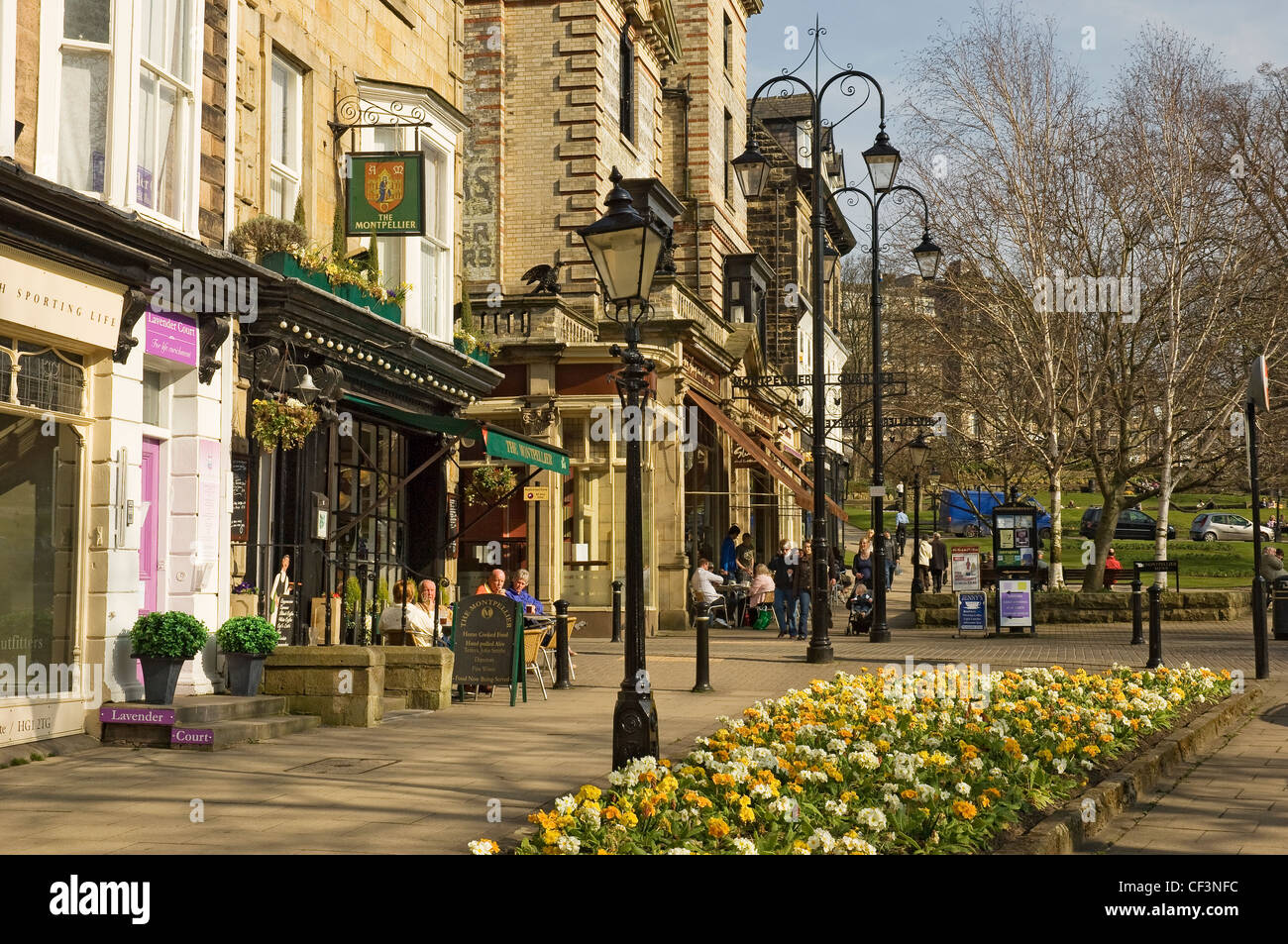 People sitting outside cafes on Montpellier Parade enjoying the spring ...