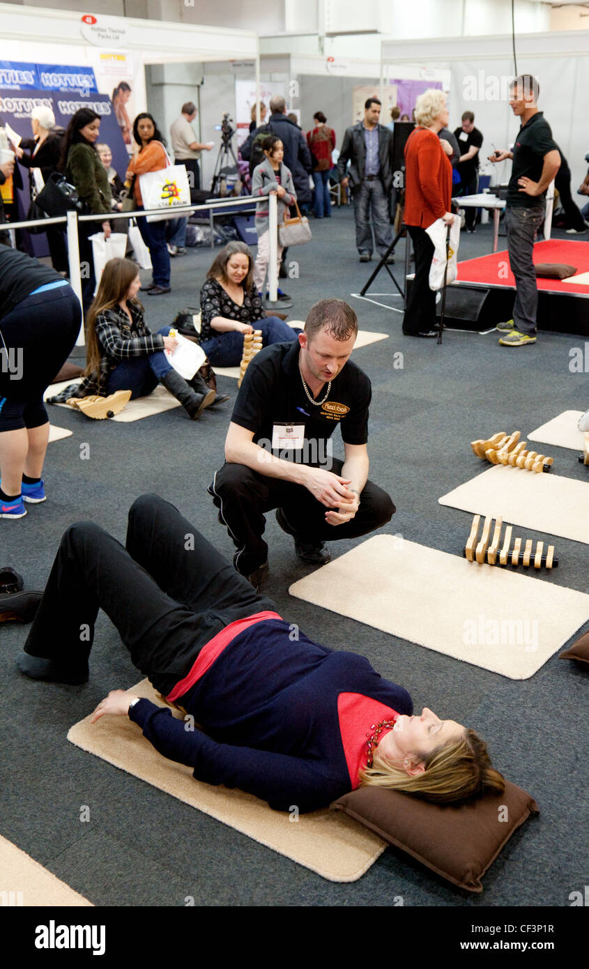 People having back pain treatment using the wooden Flexi Bak device ...