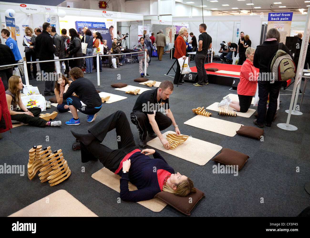 People having back pain treatment using the wooden Flexi Bak device ...