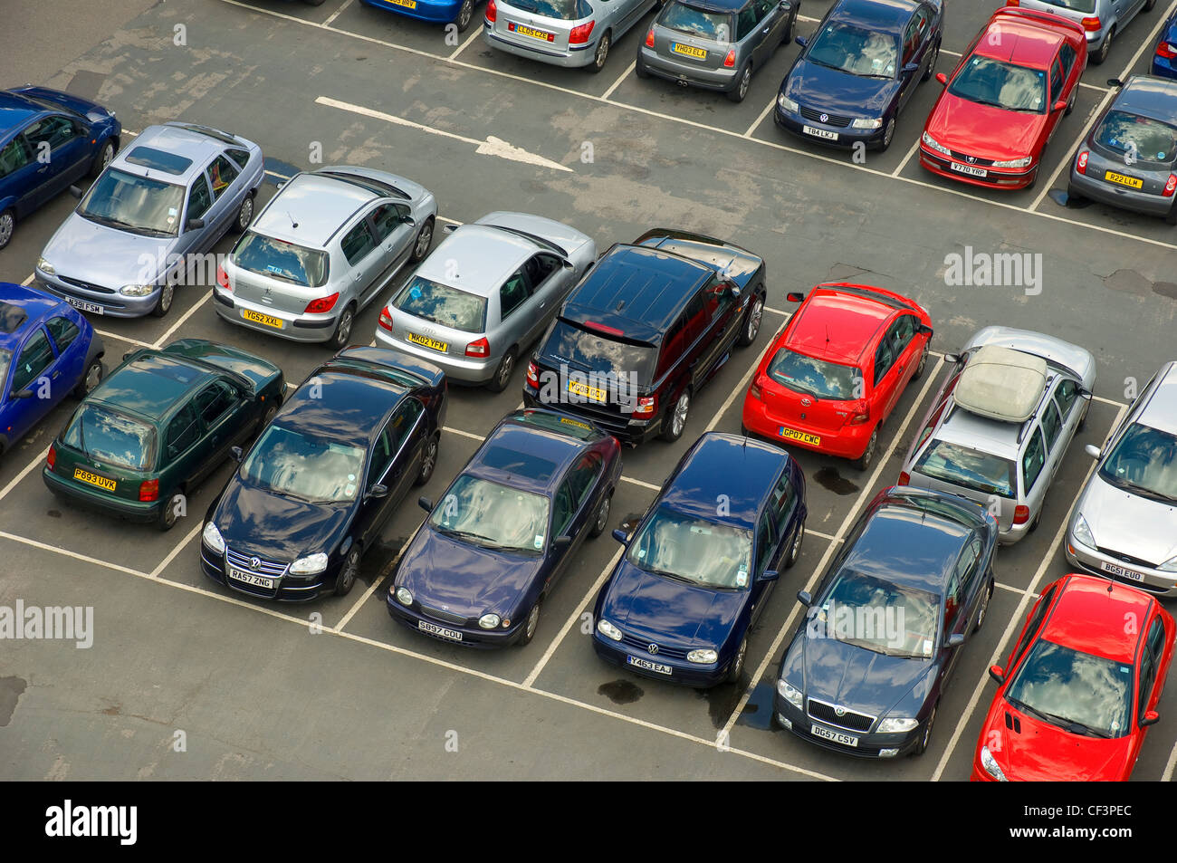 View over parked cars in a public car park Stock Photo - Alamy