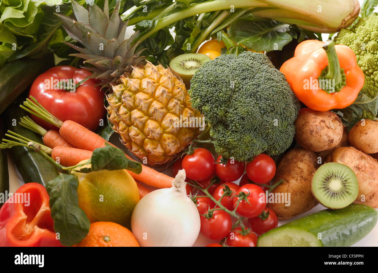 Still life of fruit and vegetables on white background including ...