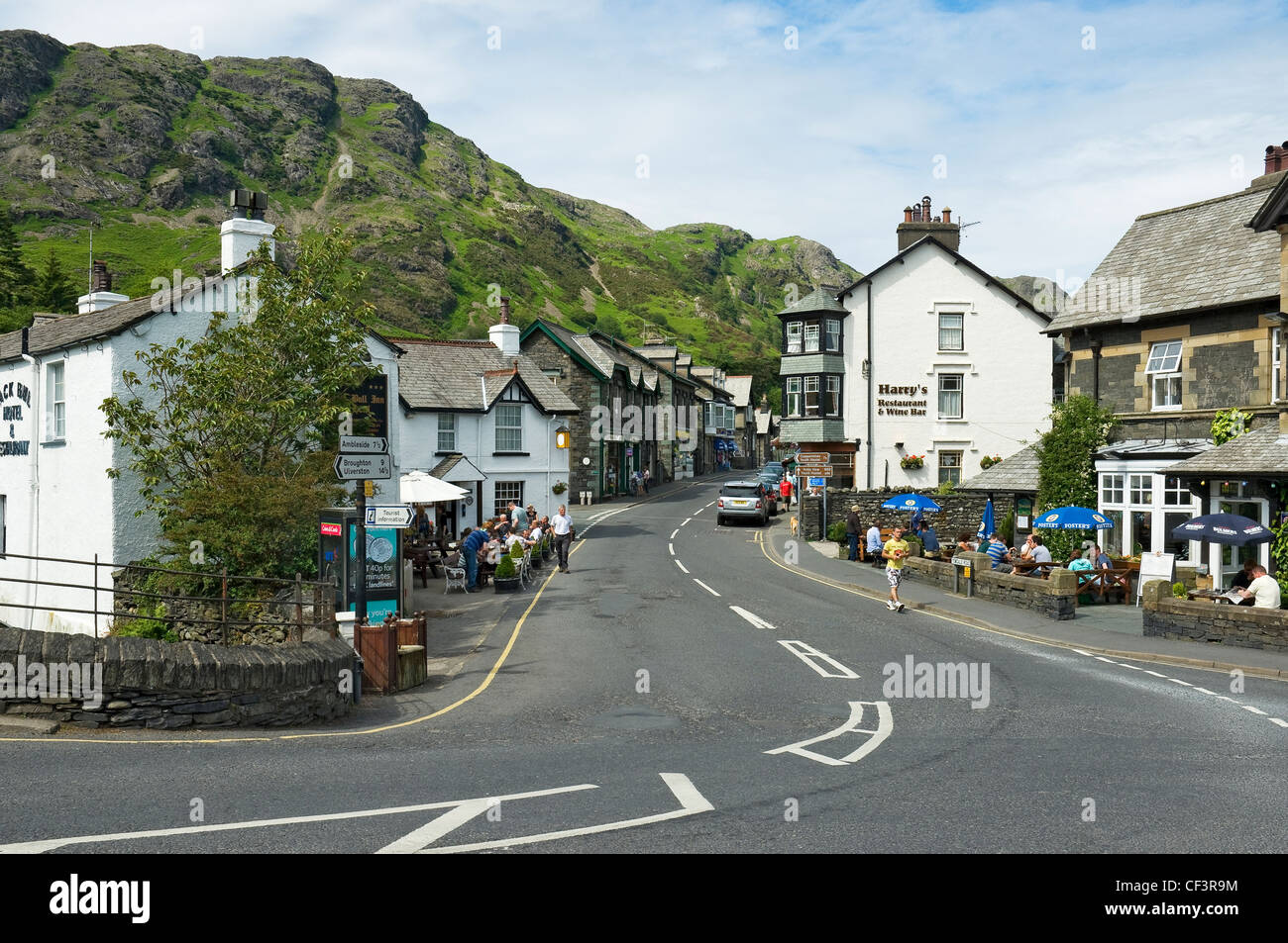 A road leading through the village of Coniston Stock Photo - Alamy