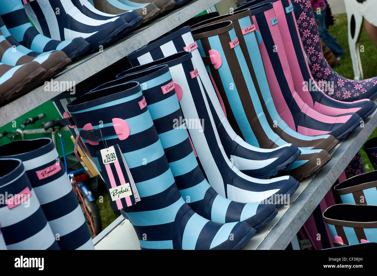 Display of colourful wellies for sale Stock Photo - Alamy