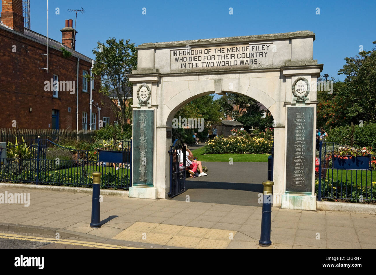 The War Memorial Arch and Garden in Filey. The arch is inscribed with ...