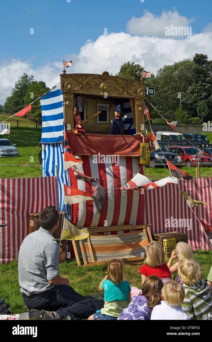 Young children enjoying a Punch and Judy at Gargrave Show, an annual ...