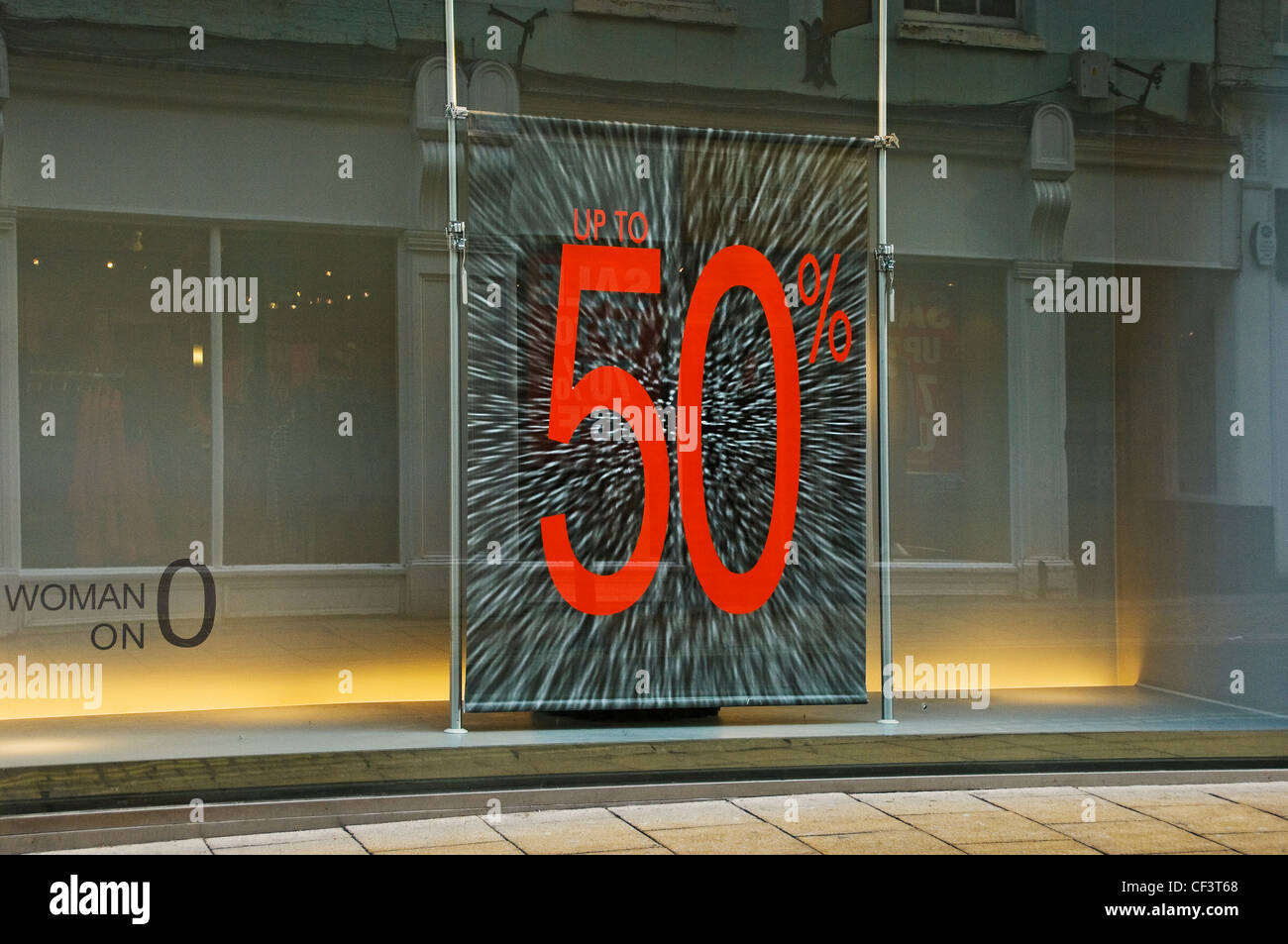 A large 'up to 50%' sale sign in a shop window Stock Photo - Alamy