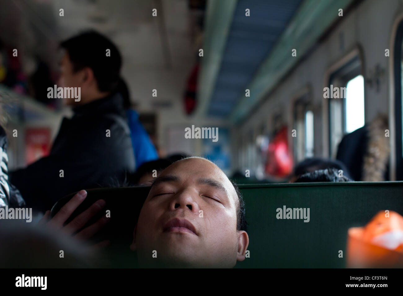 Man sleeping on the train hi-res stock photography and images - Alamy