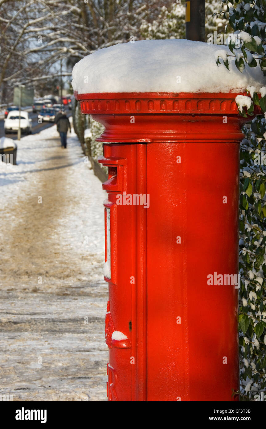 Traditional red post box in winter Stock Photo - Alamy