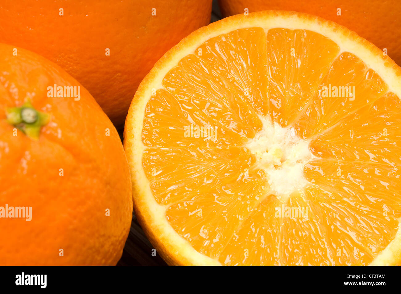 Whole and cut oranges Stock Photo - Alamy