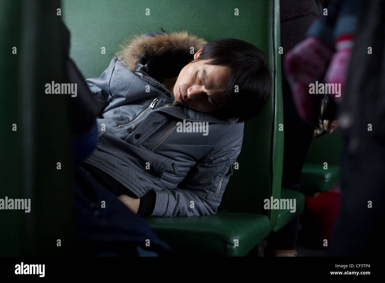 Man sleeping on the train hi-res stock photography and images - Alamy