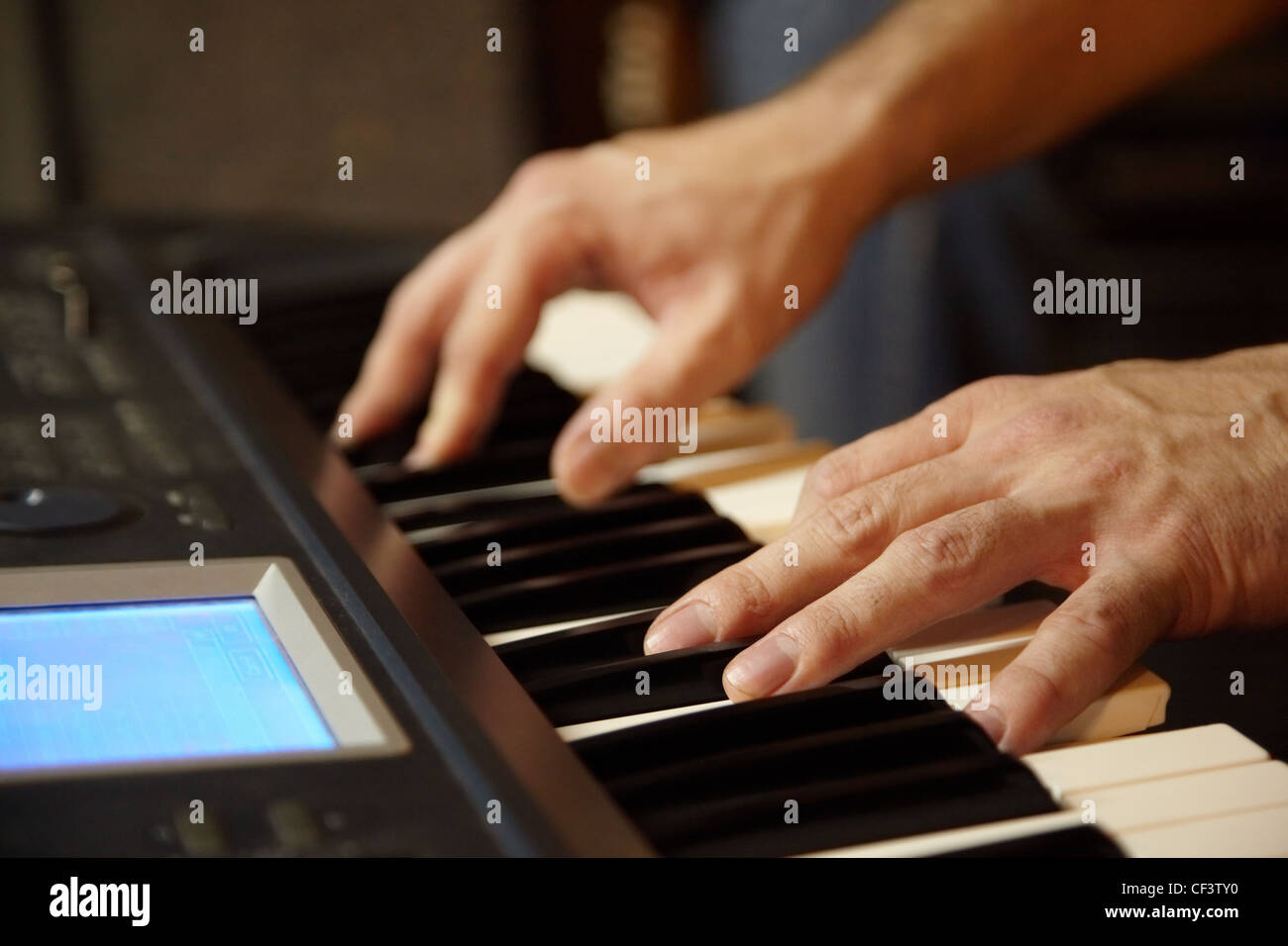 keyboard player playing in studio. hands of keyboard player Stock Photo ...