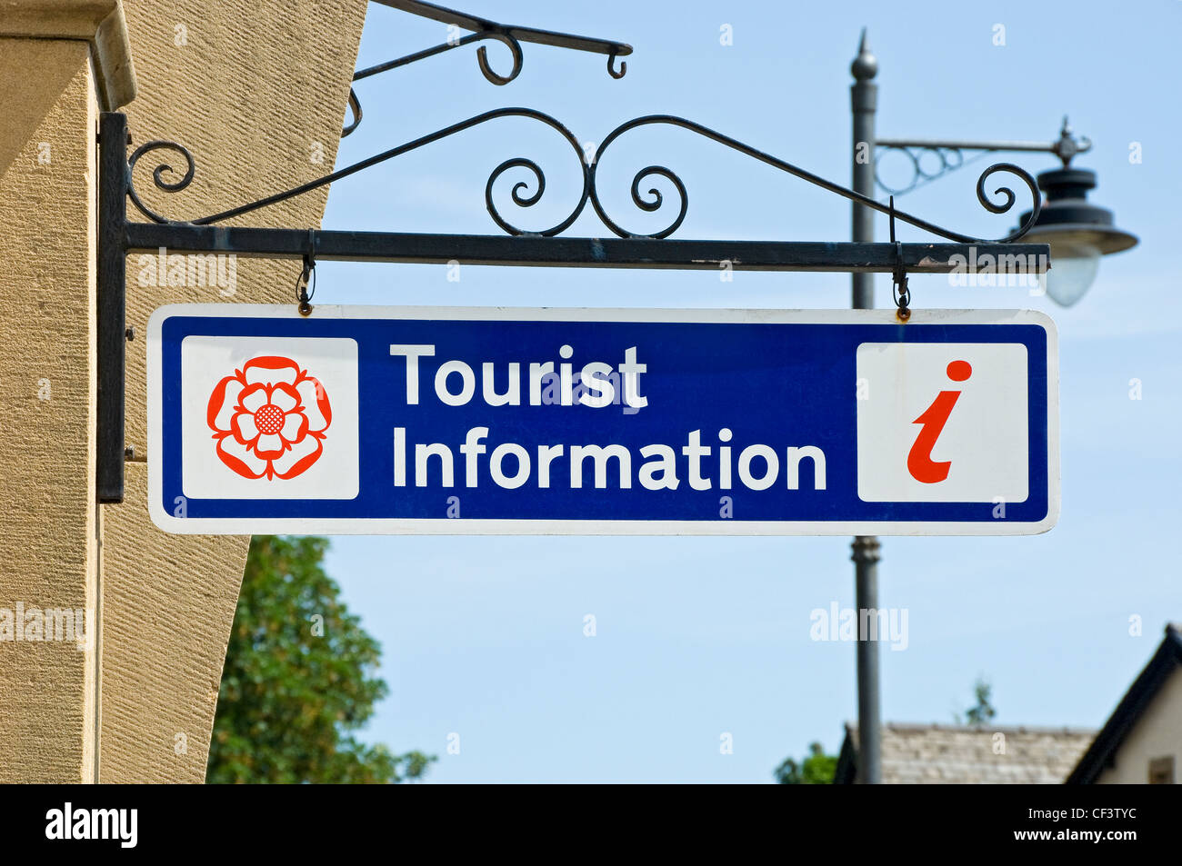 Tourist information sign hanging on wall outside visitor centre Stock ...
