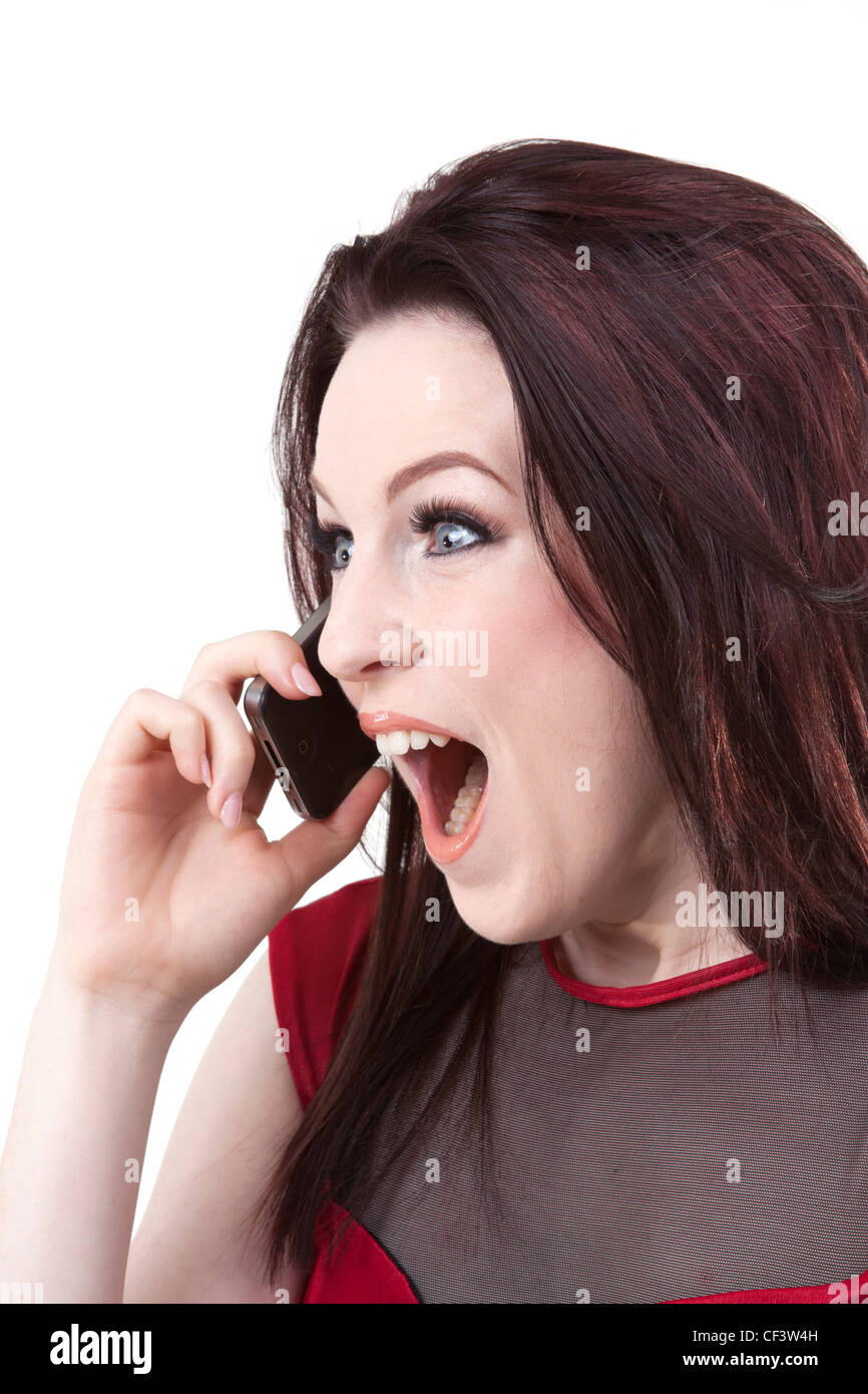 Screaming with joy on the phone to her friends Stock Photo - Alamy