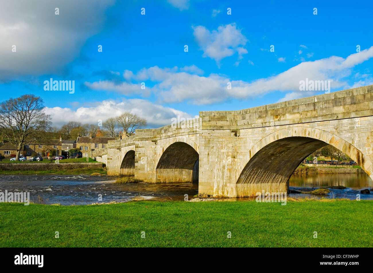 Five-arched bridge over the River Wharfe in the village of Burnsall in ...