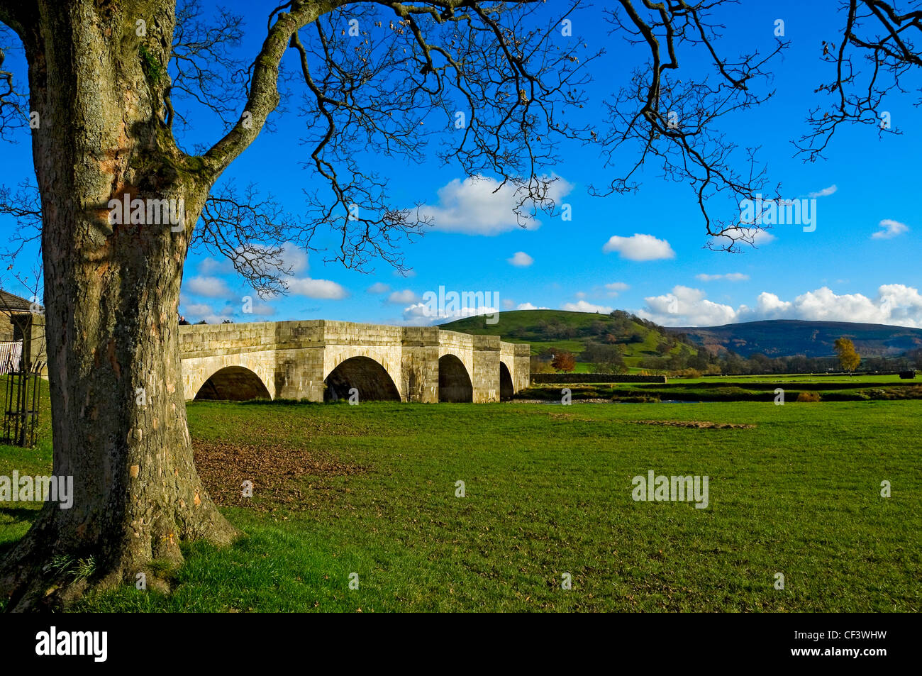 Five-arched bridge over the River Wharfe in the village of Burnsall in ...