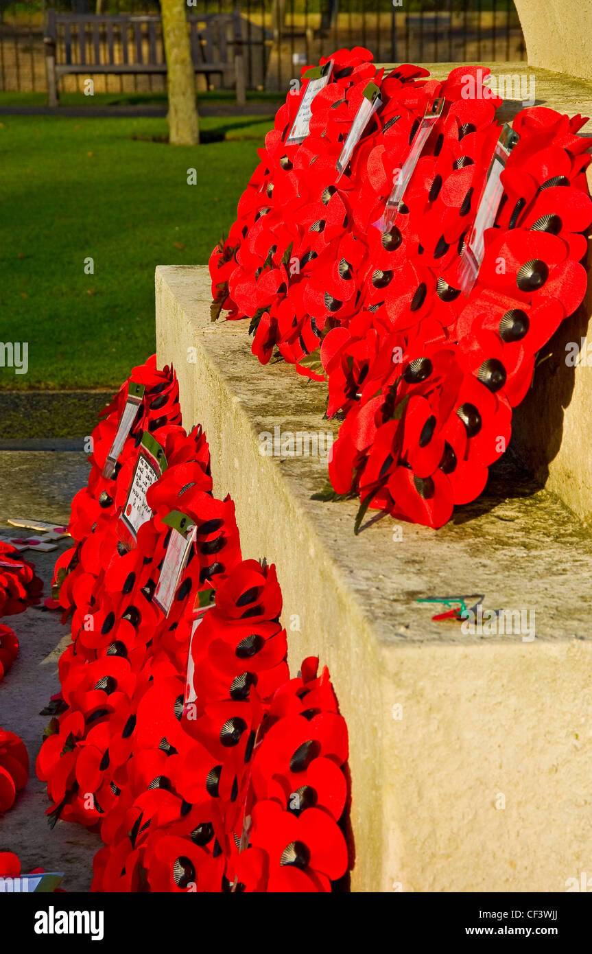 Poppy wreaths arranged at the base of the war memorial the War Memorial ...
